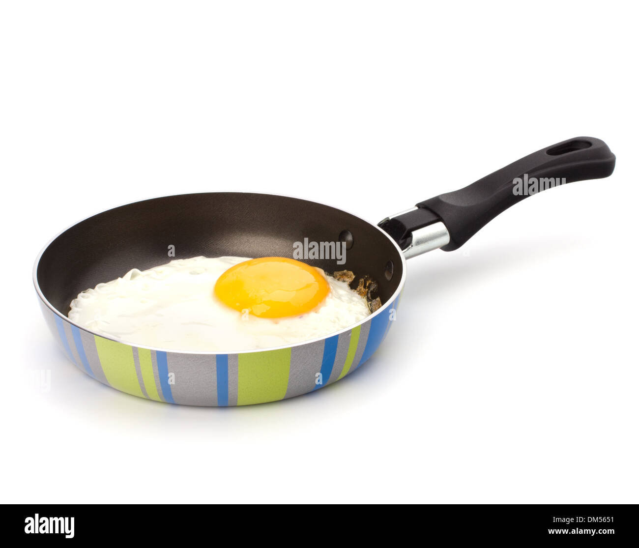 Fried egg on pan over white background Stock Photo - Alamy