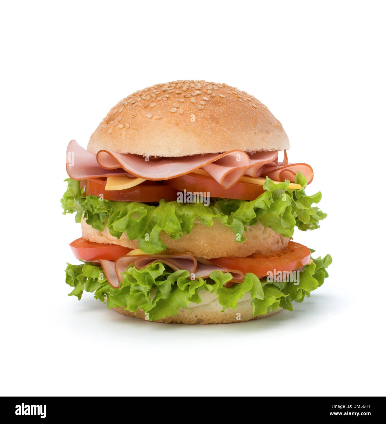 Big appetizing fast food sandwich with lettuce, tomato, smoked ham and ...