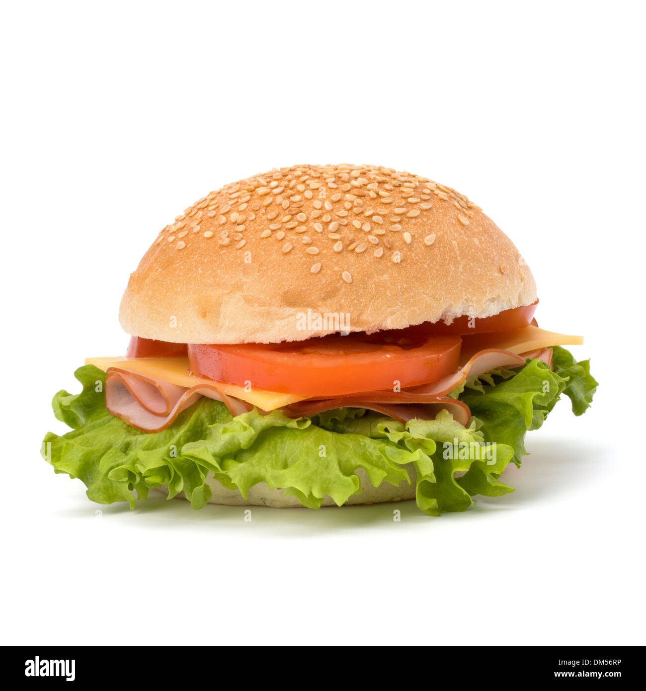 Big appetizing fast food sandwich with lettuce, tomato, smoked ham and ...