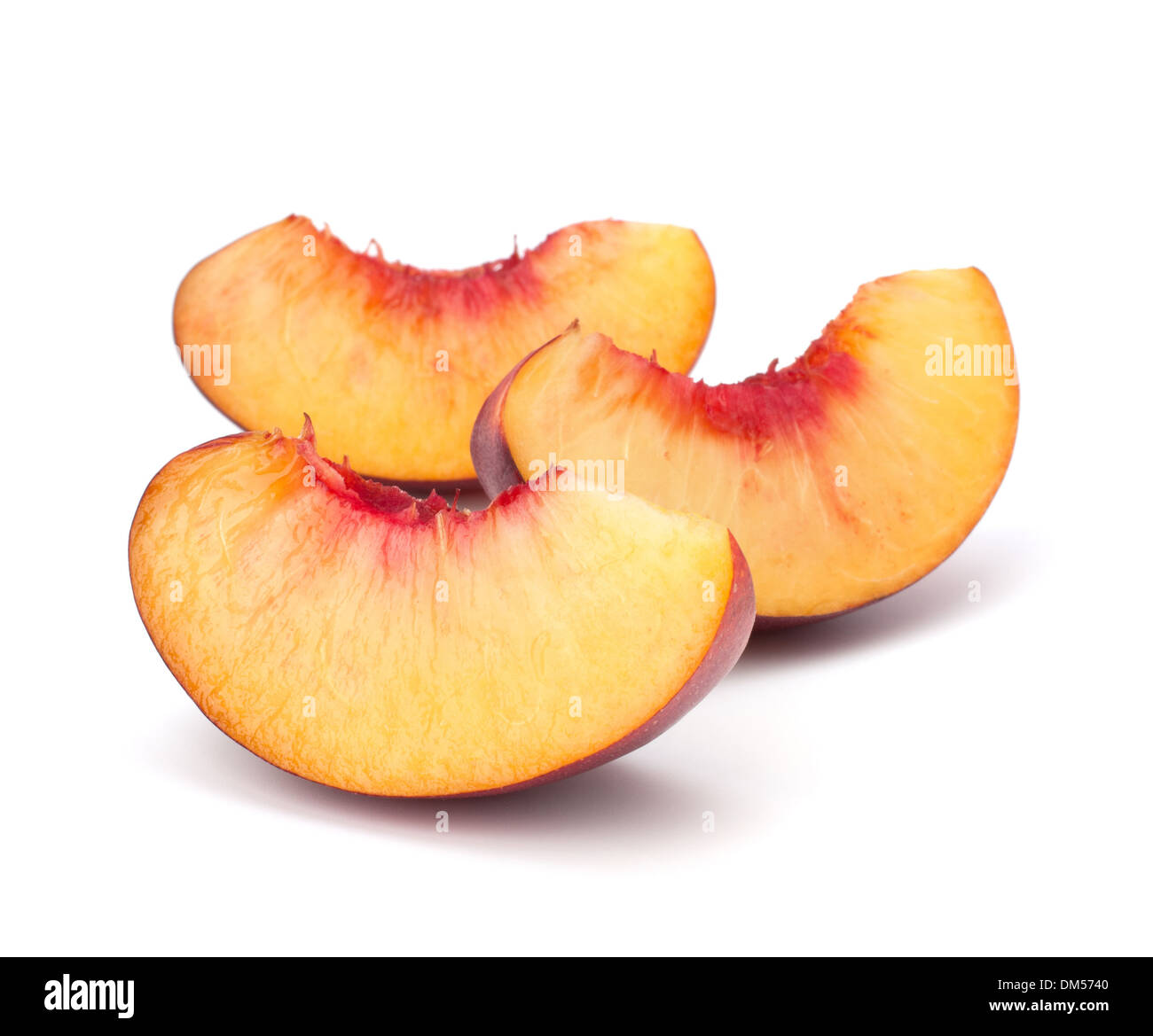 Nectarine fruit segments isolated on white background Stock Photo - Alamy