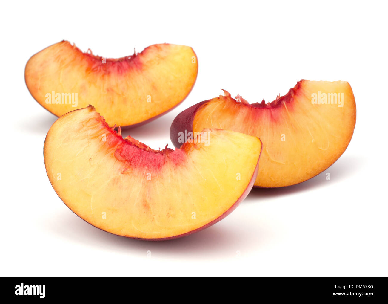 Nectarine fruit segments isolated on white background Stock Photo - Alamy