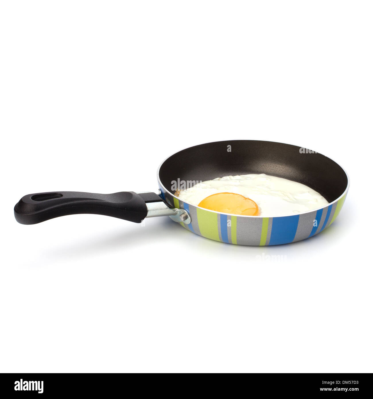 Fried egg on pan over white background Stock Photo - Alamy