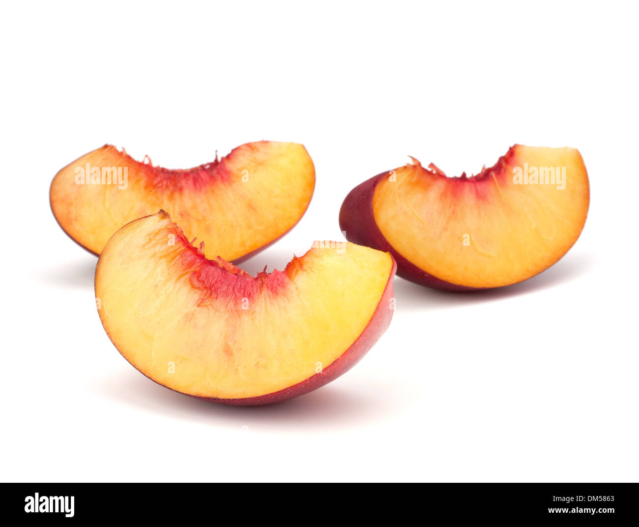 Nectarine fruit segments isolated on white background Stock Photo - Alamy