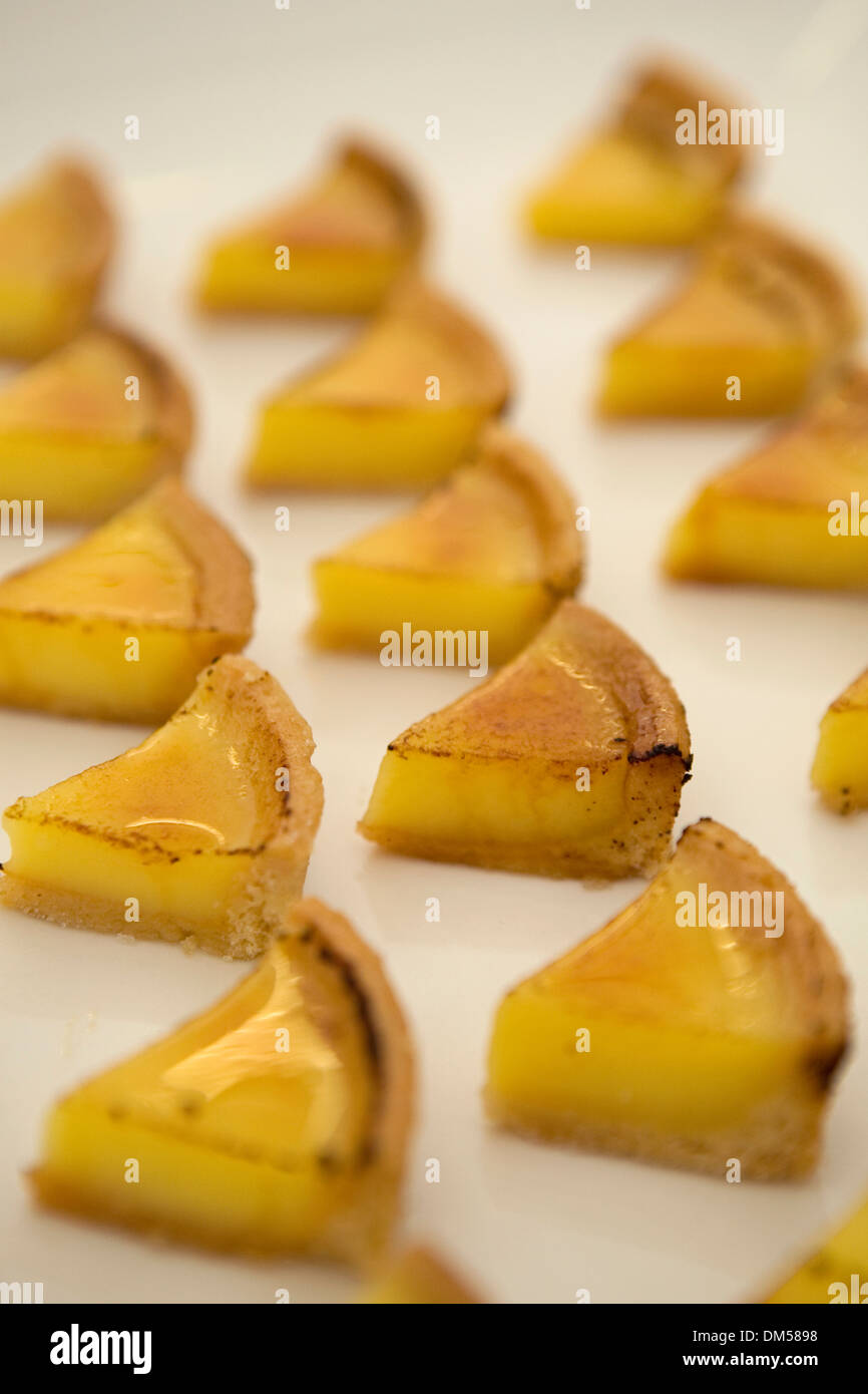 Mini custard tart slices Stock Photo - Alamy