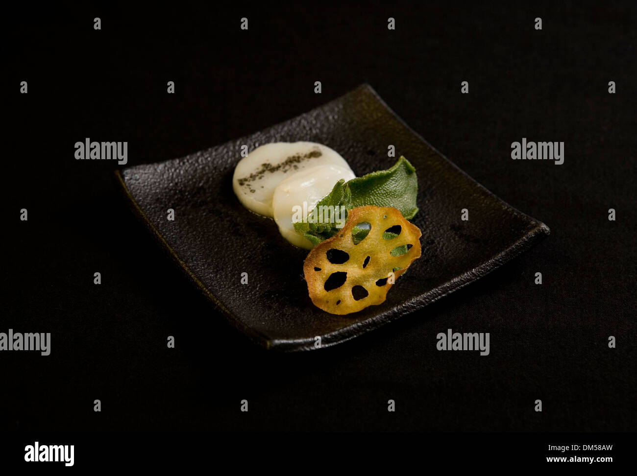 Asian-inspired starter with lotus root slice Stock Photo - Alamy