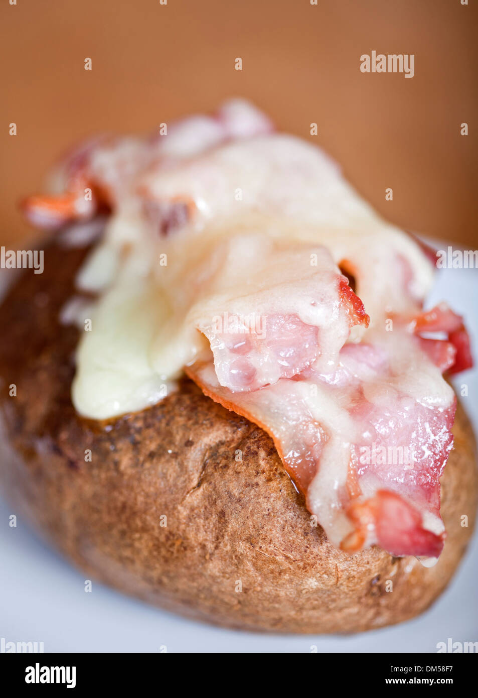 Fresh baked potato on a white plate Stock Photo - Alamy