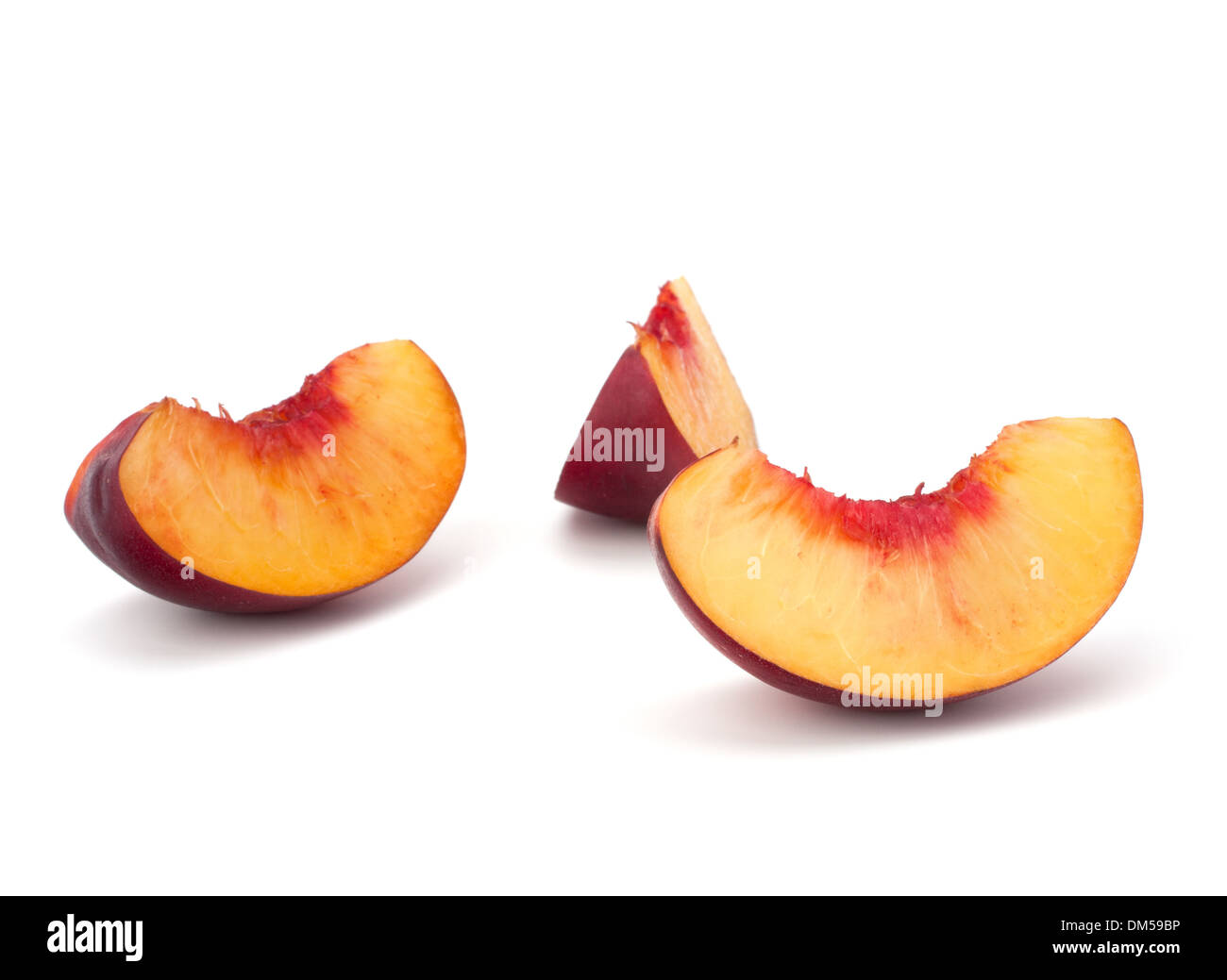 Nectarine fruit segments isolated on white background Stock Photo - Alamy