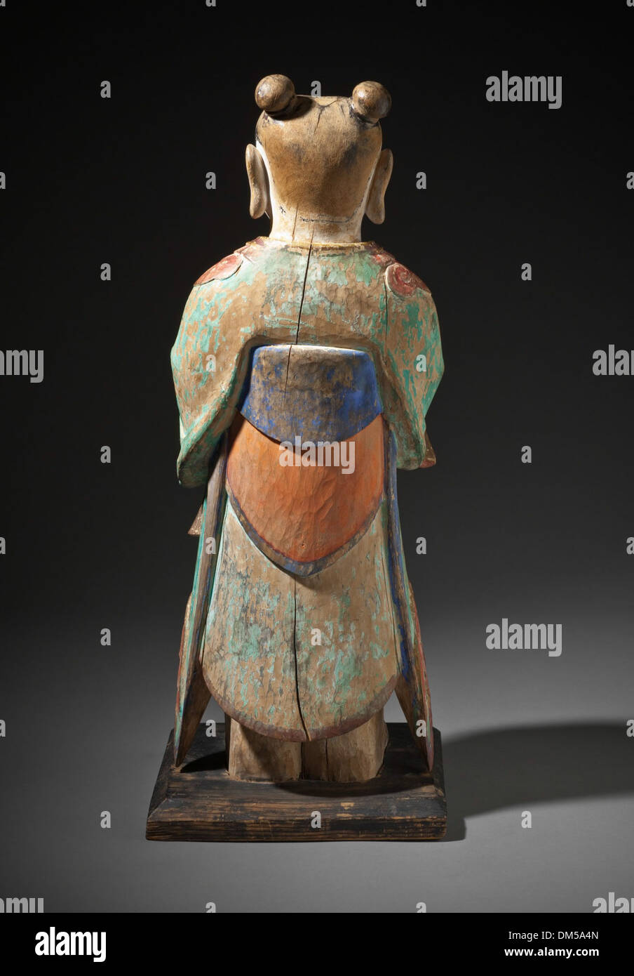 This sculpture depicts an altar attendant (Tongja) holding a phoenix, a ...