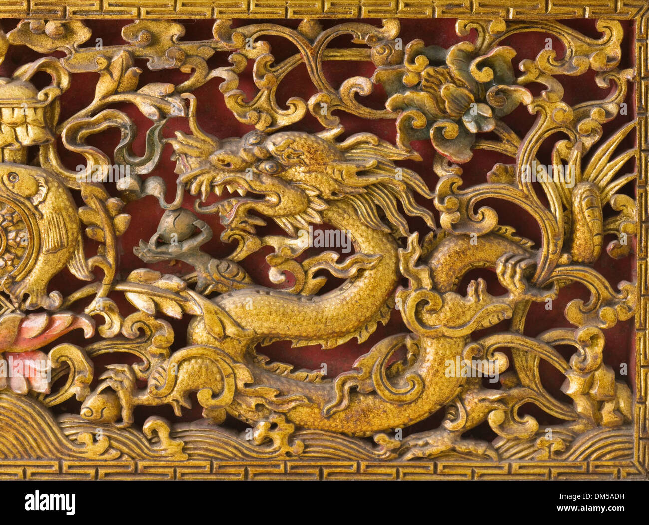 This altar table features intricate carvings of dragons and auspicious ...