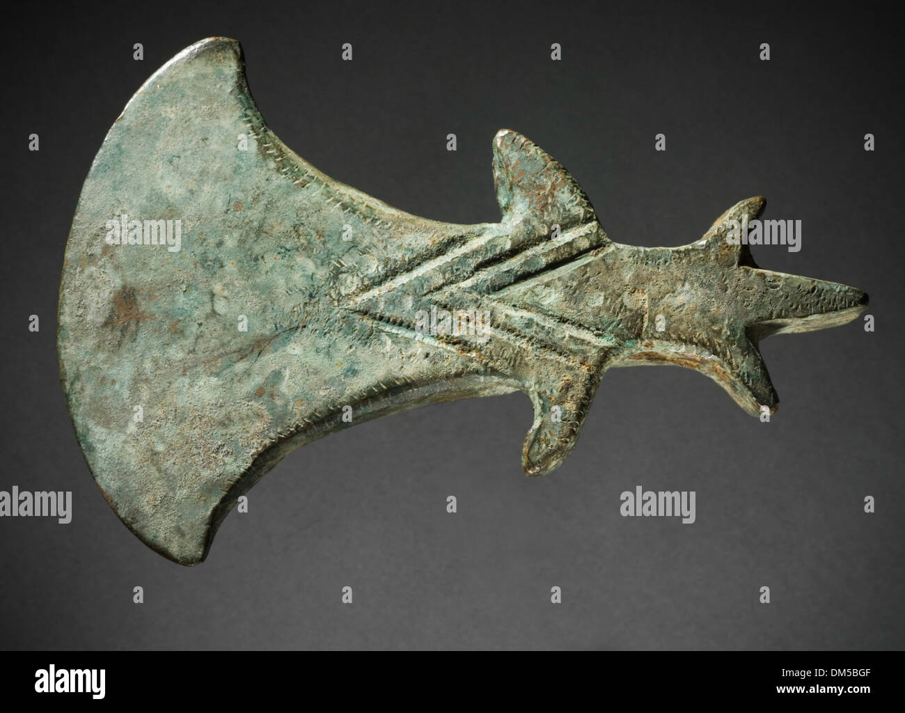 This axe head is an artifact from ancient times, showcasing early tool ...