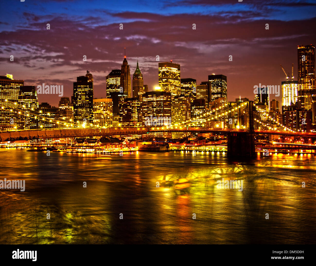 Historic Brooklyn Bridge and lower Manhattan reflected in East River ... Historic Brooklyn Bridge and lower Manhattan reflected in East River ...