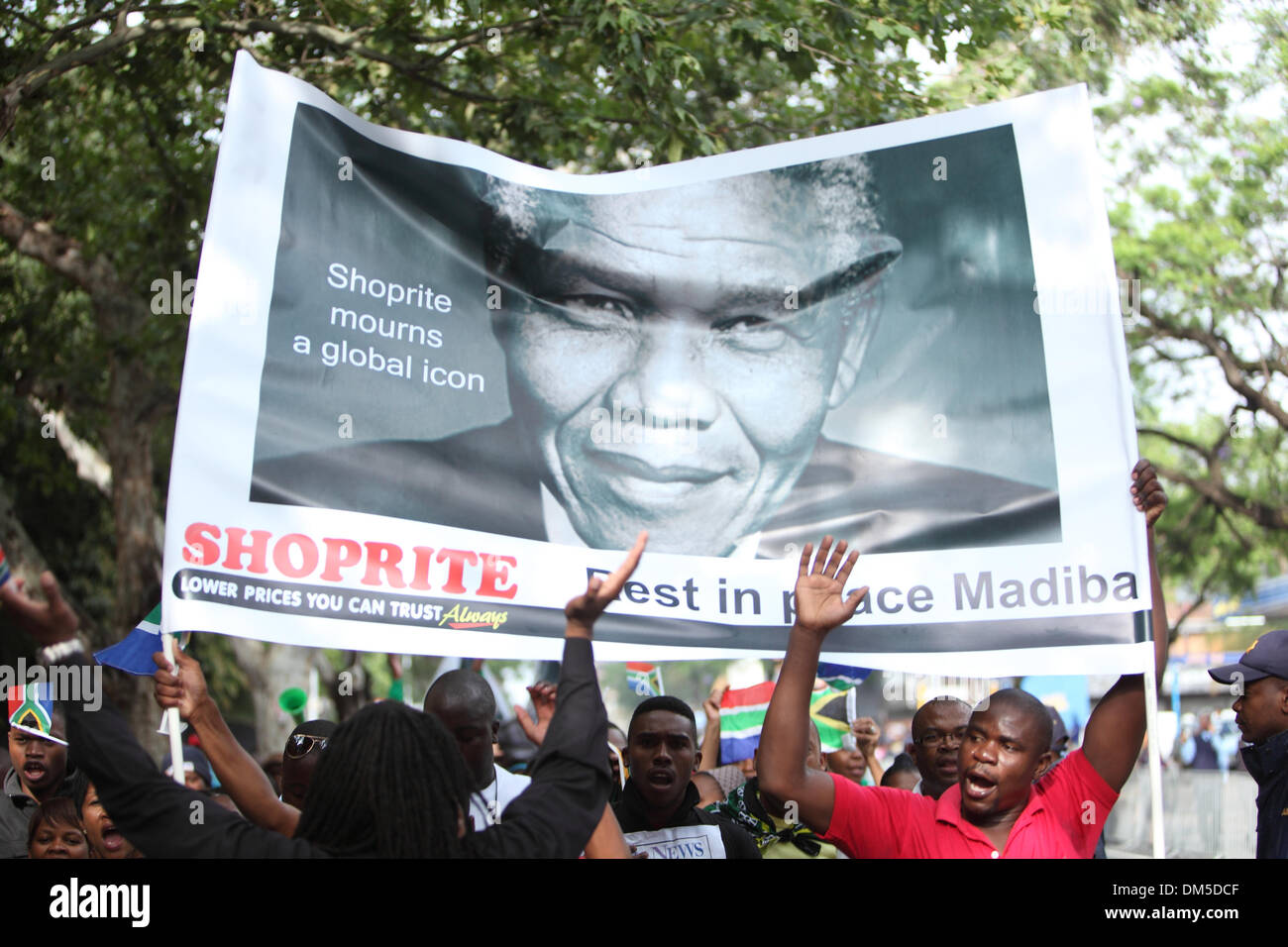 Pretoria, South Africa. 11th Dec, 2013. Mourners line the streets to ...