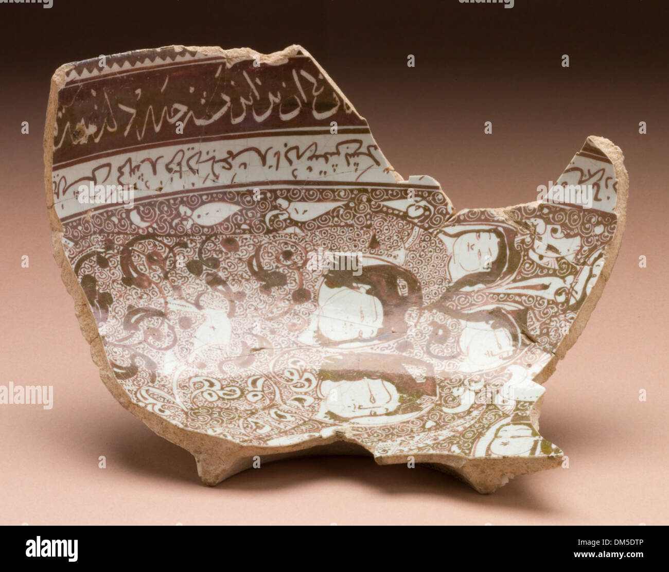 This bowl fragment showcases intricate pottery work, highlighting the ...