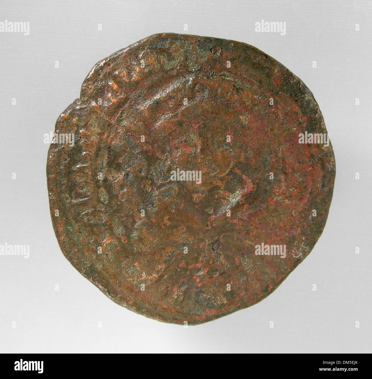 This bronze dirham coin dates back to the medieval period and features ...