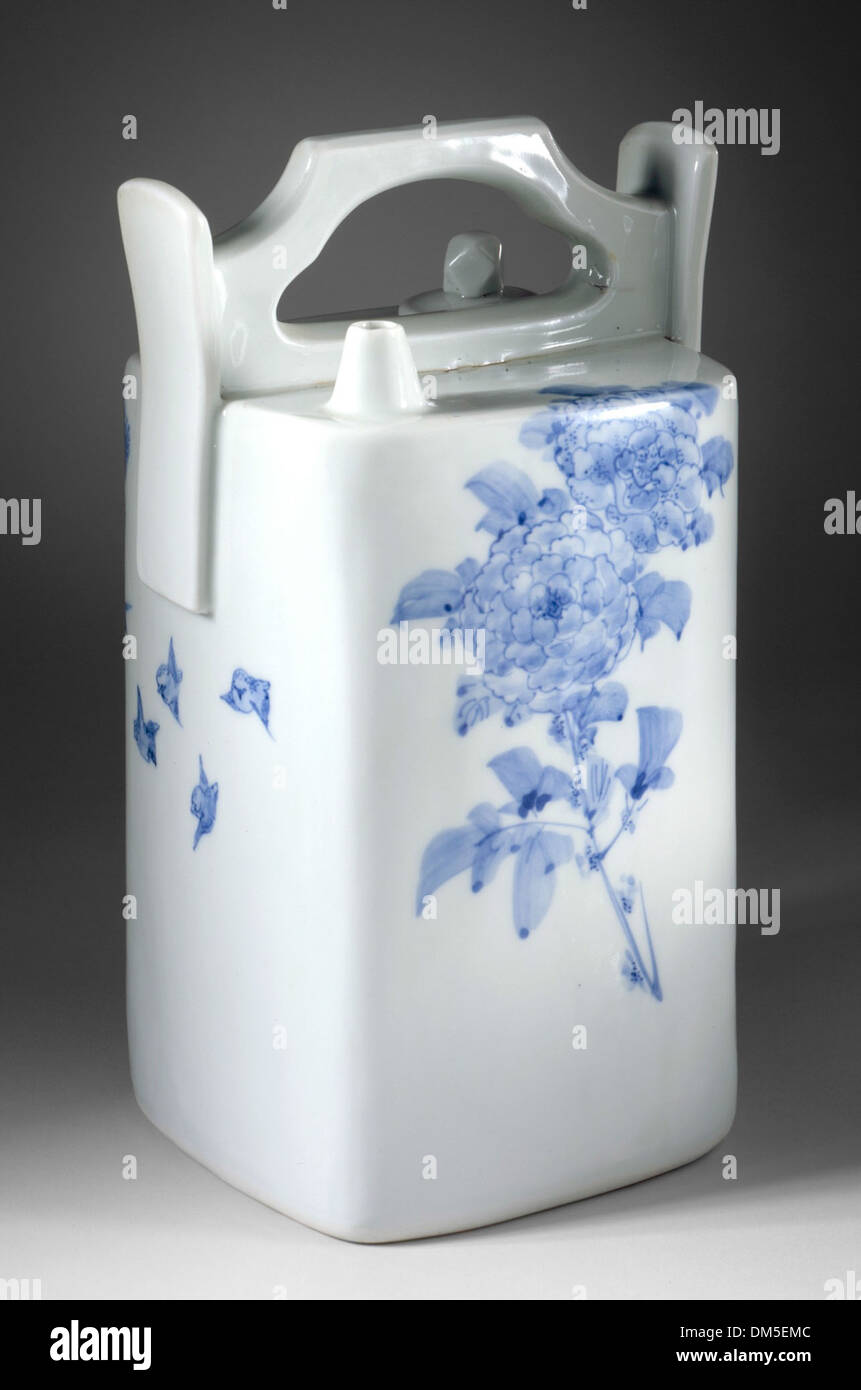 This sake vessel, shaped like a bucket, features intricate designs of a ...