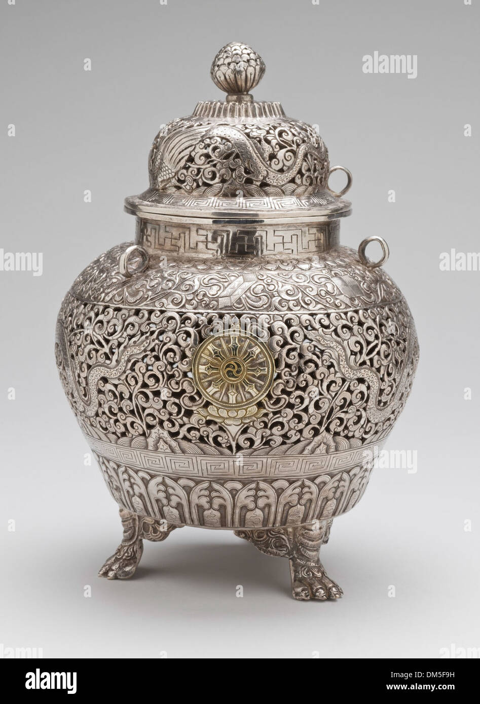 This censer, a ritual vessel, features intricate details and symbolic ...