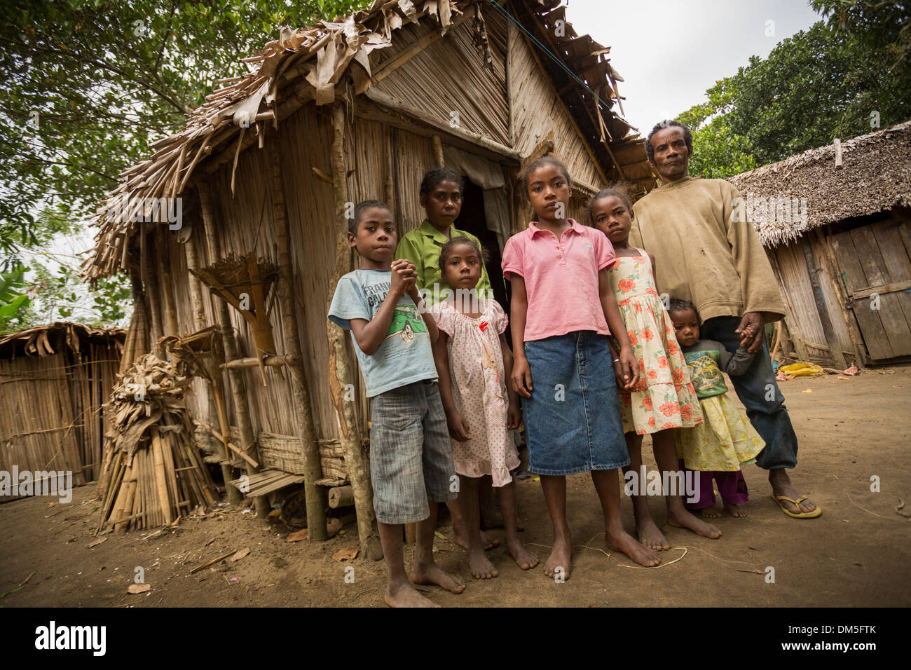 Family outside their home in Fenerive Est District, Madagascar Stock ...