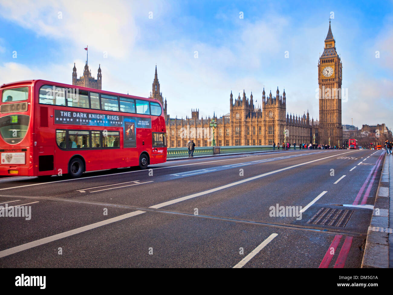LONDON - DEC 21: Iconic London bus crossing Westminster Bridge in the ...