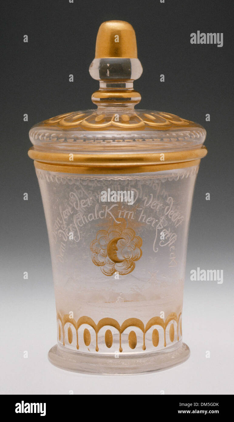 This covered beaker is adorned with celestial motifs of the sun and ...
