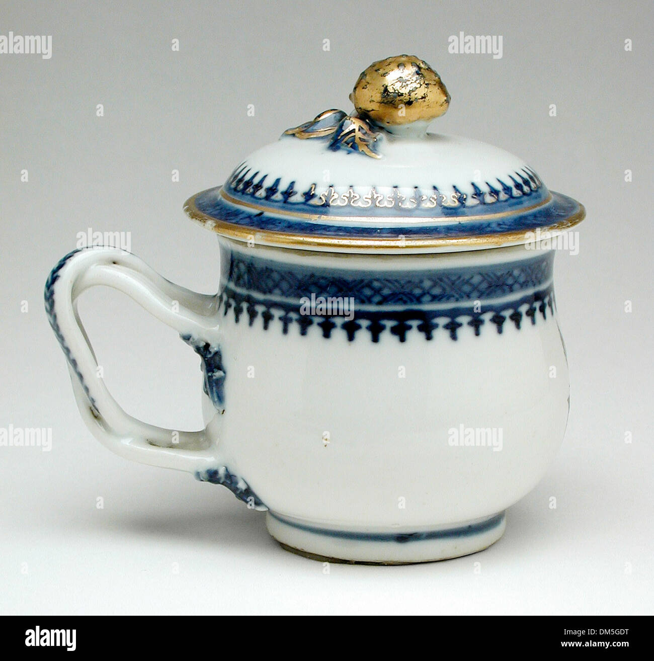 This covered cup and hot-water plate set is part of a two-piece set ...