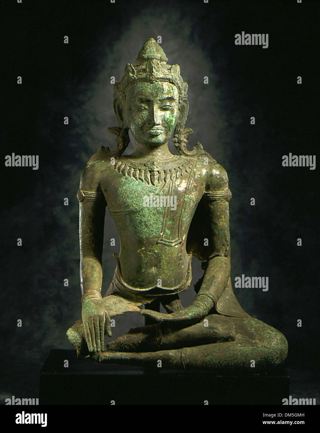 This sculpture represents a crowned Buddha, symbolizing both ...