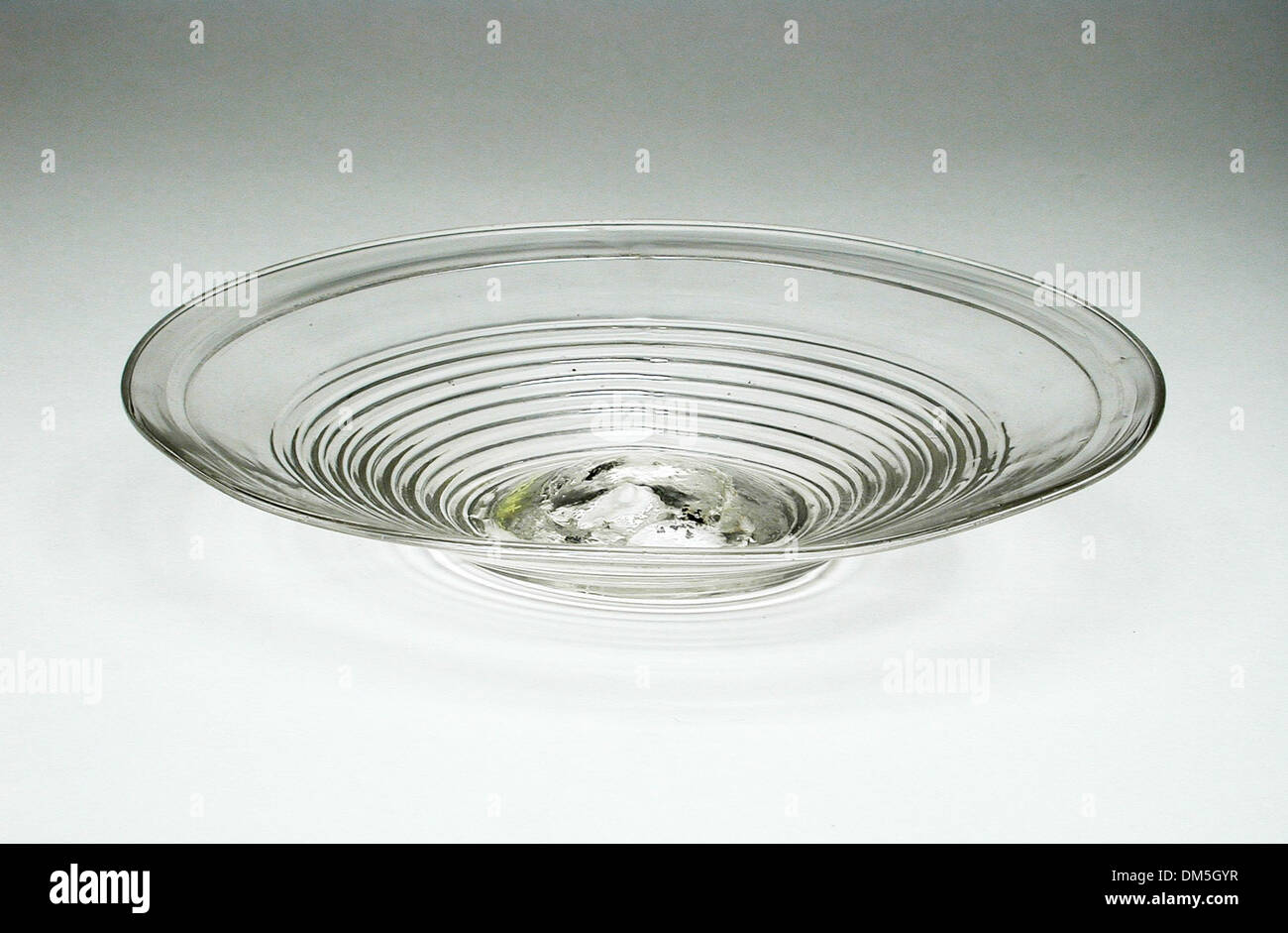 This deep plate features intricate design and craftsmanship ...