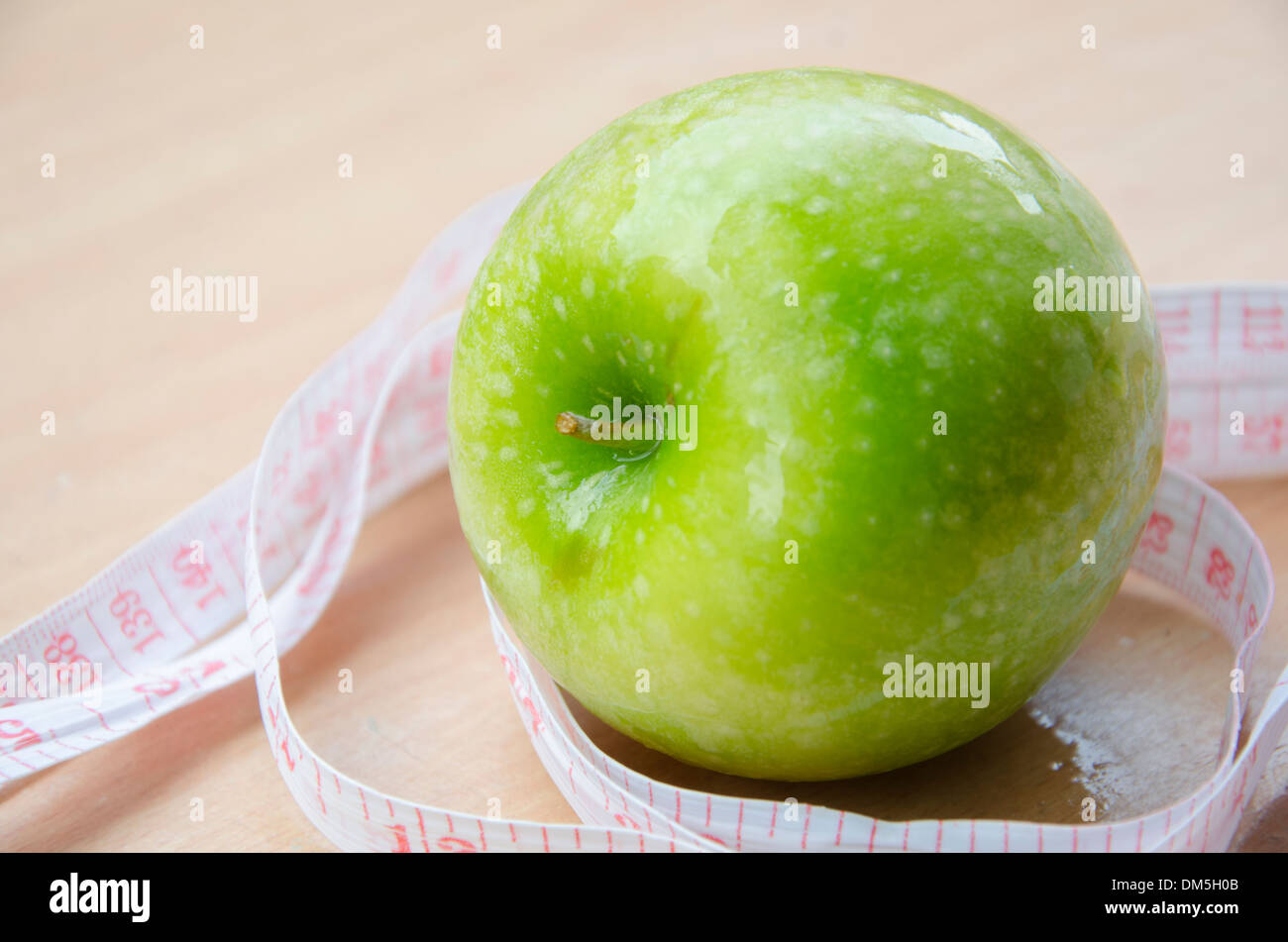 Sugar Free Green apple core and measuring tape. Diet concept Stock ...