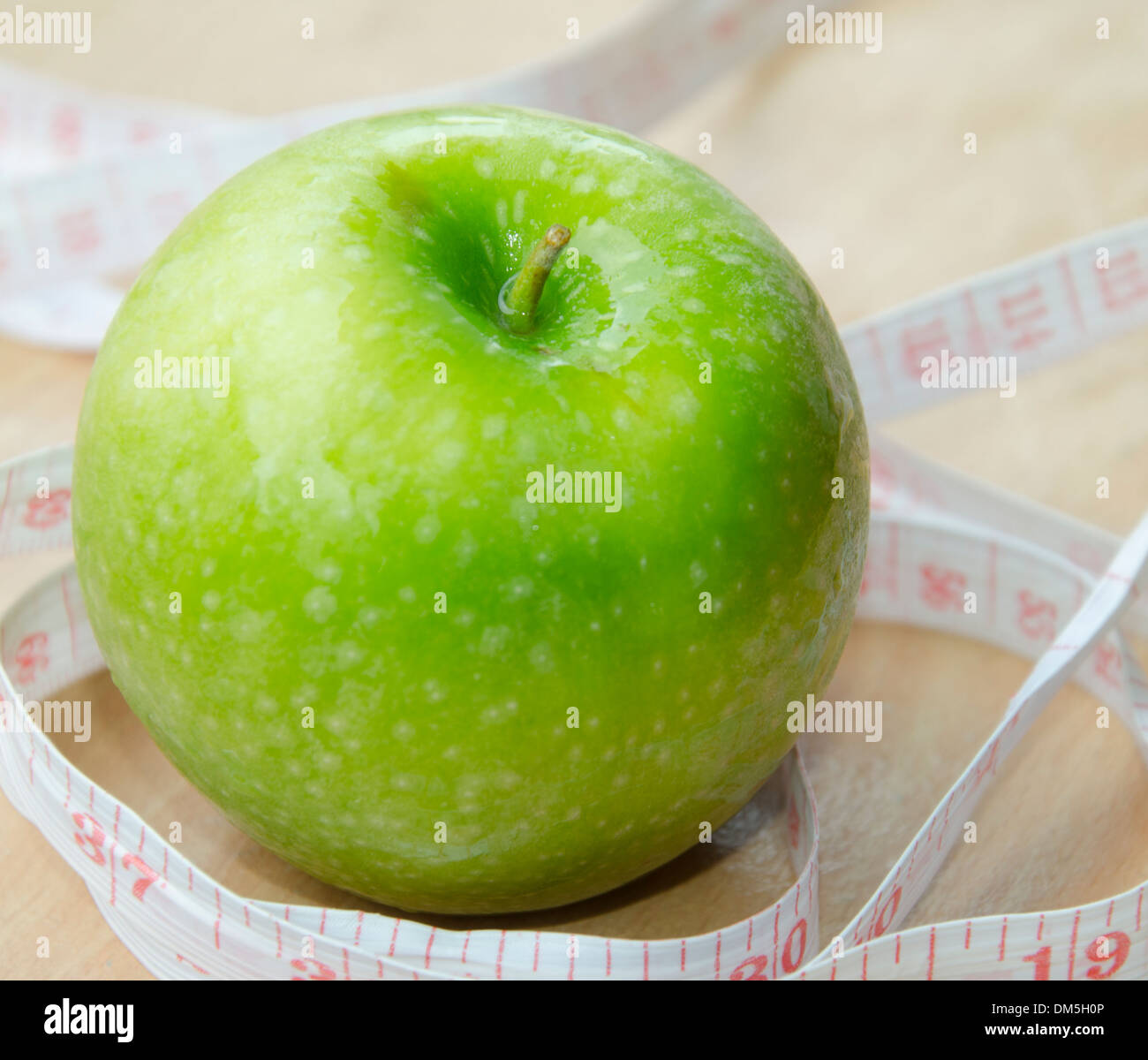 Sugar Free Green apple core and measuring tape. Diet concept Stock ...