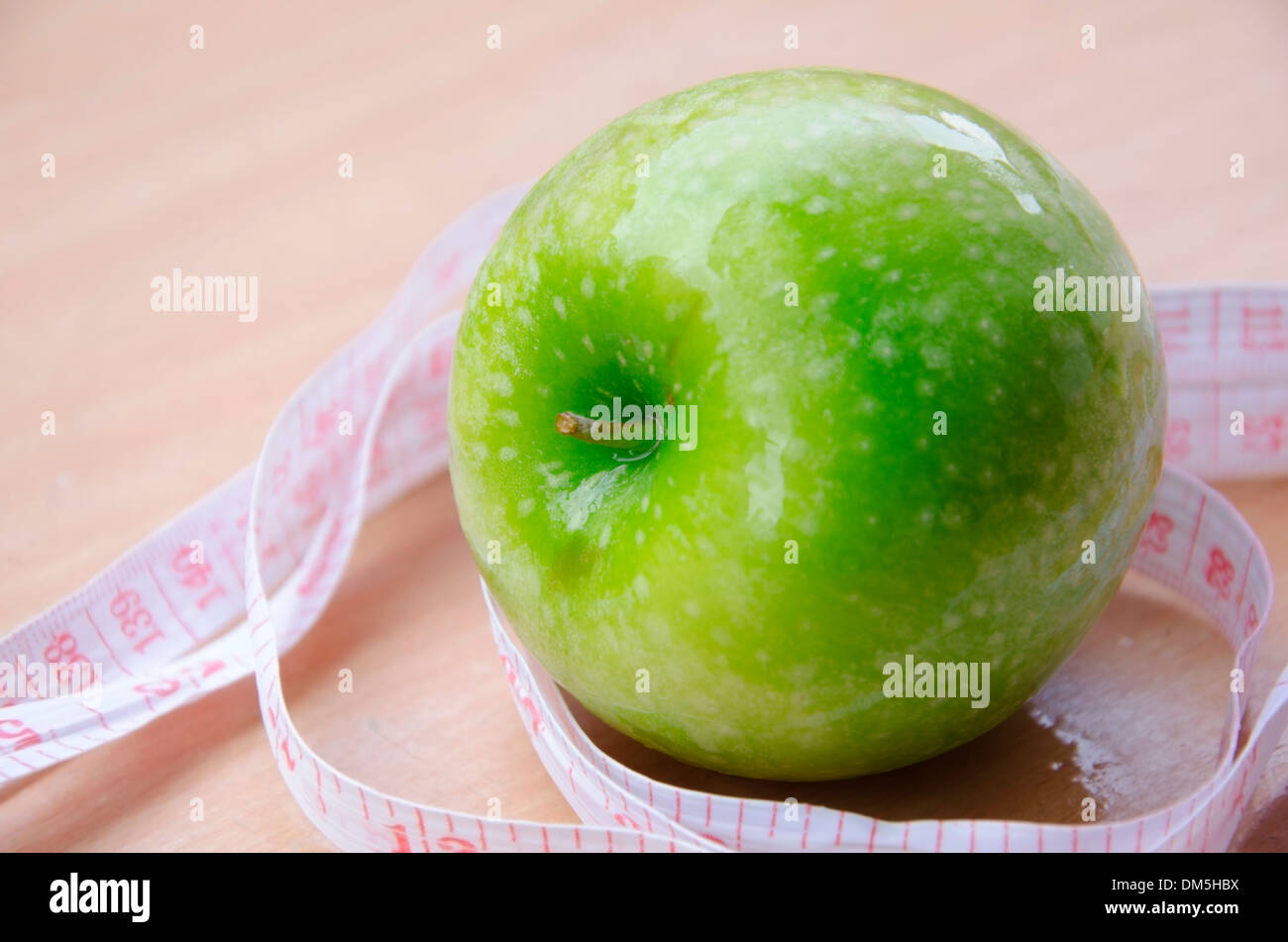 Sugar Free Green apple core and measuring tape. Diet concept Stock ...
