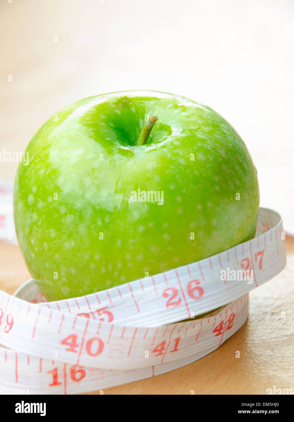 Sugar Free Green apple core and measuring tape. Diet concept Stock ...