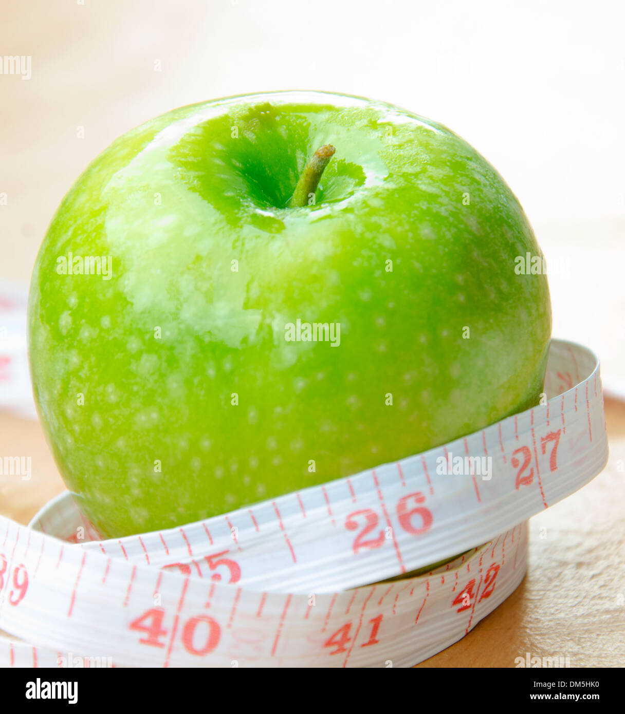Sugar Free Green apple core and measuring tape. Diet concept Stock ...