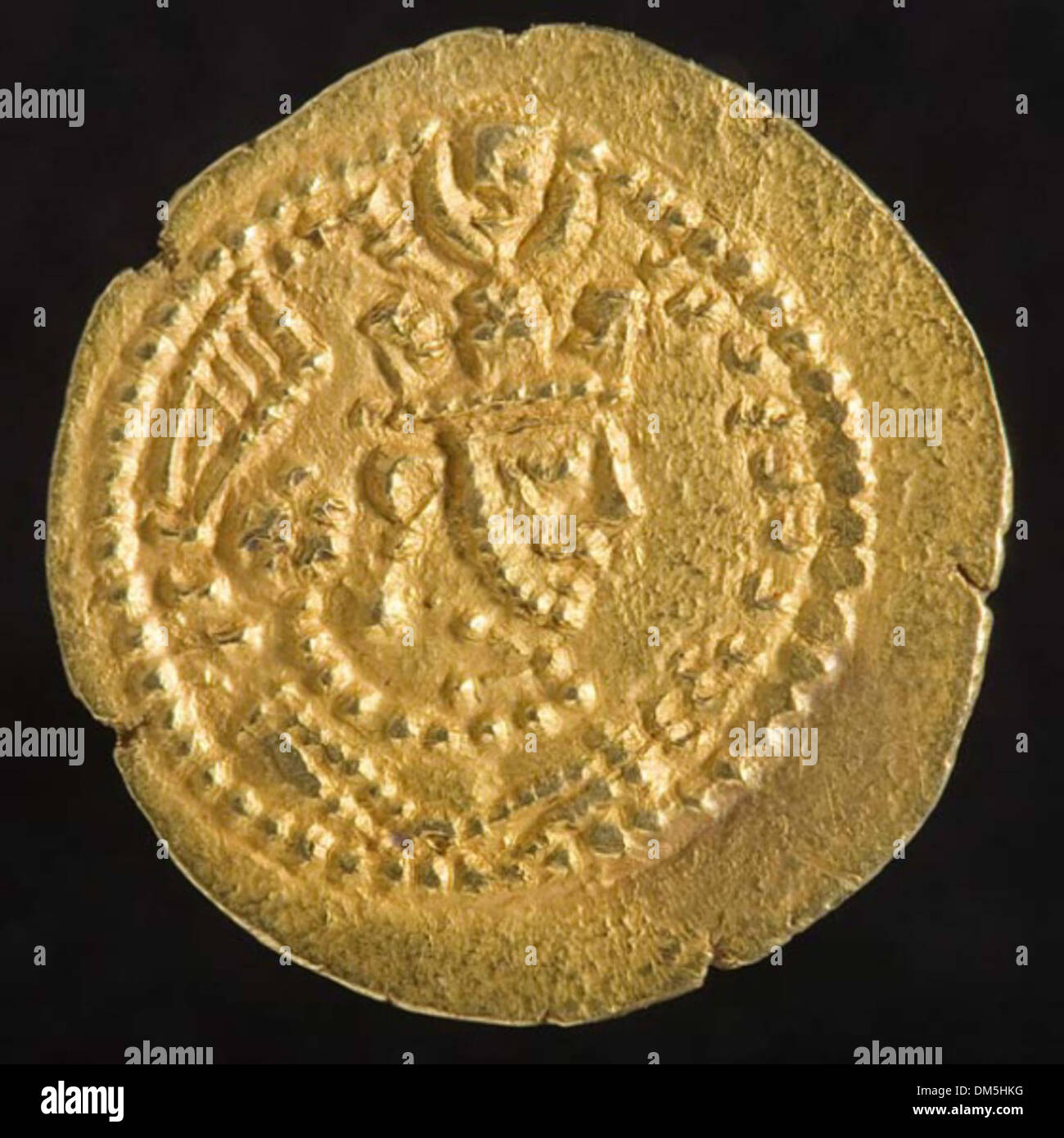 This Dinar coin, a key historical artifact, features intricate designs ...