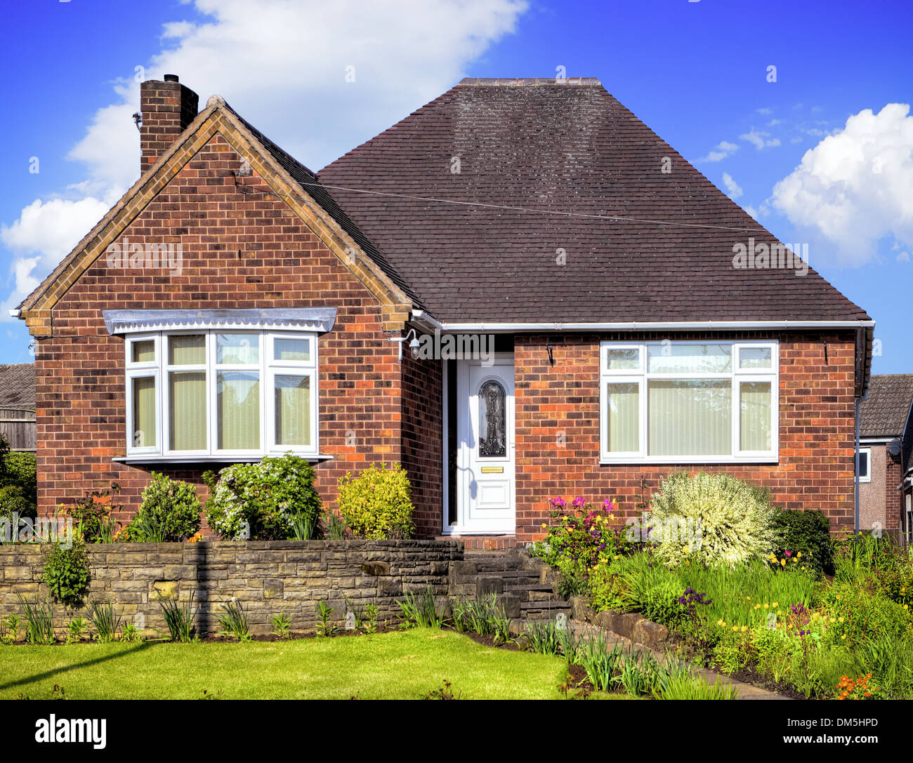 Red brick house with garden Stock Photo - Alamy
