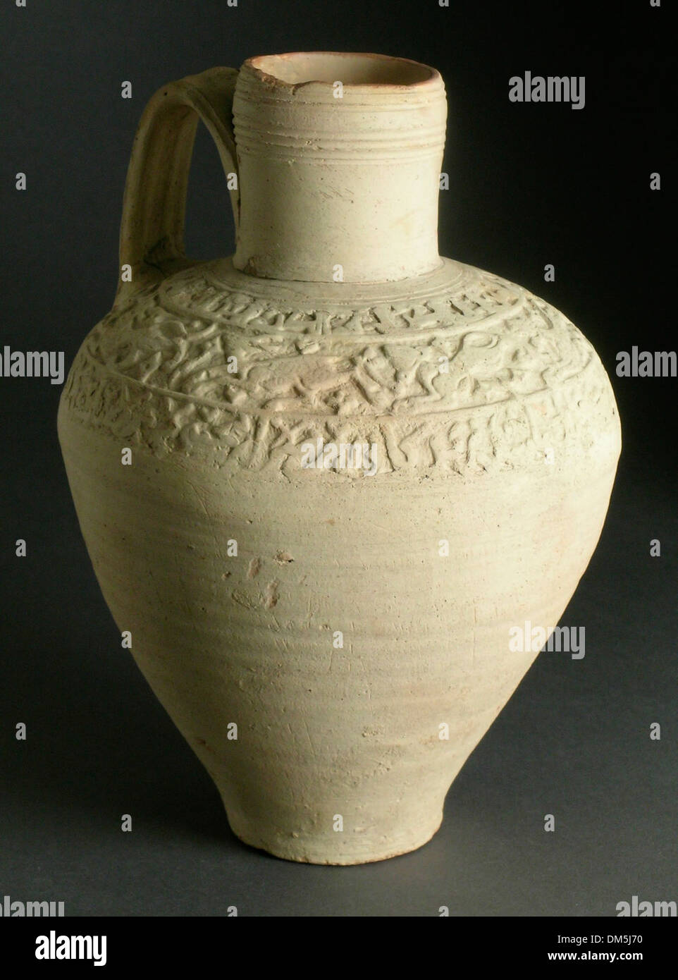 This ewer, a traditional vessel, is designed for pouring liquids. Its ...