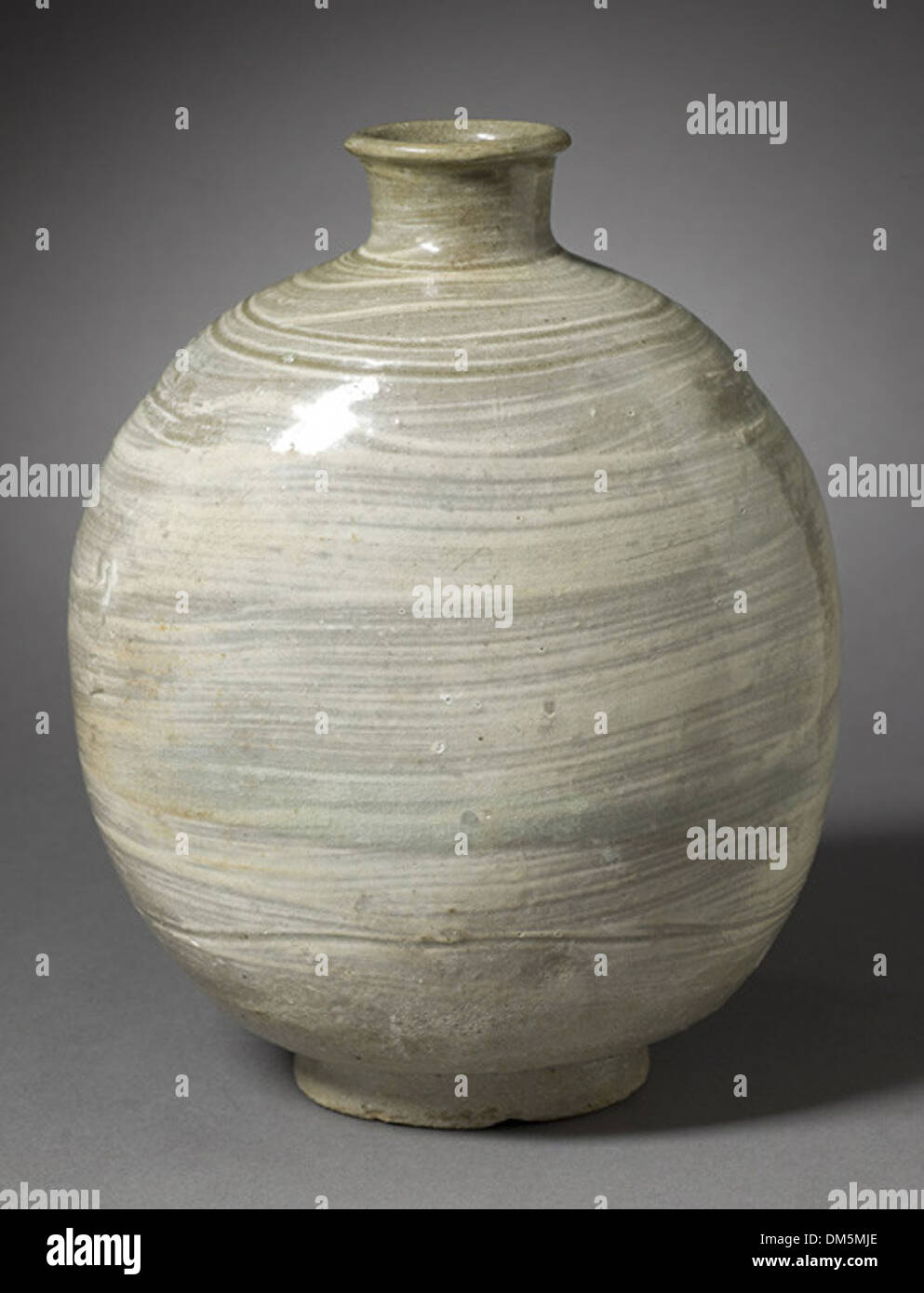 This flattened jar is a unique ceramic vessel that offers a glimpse ...