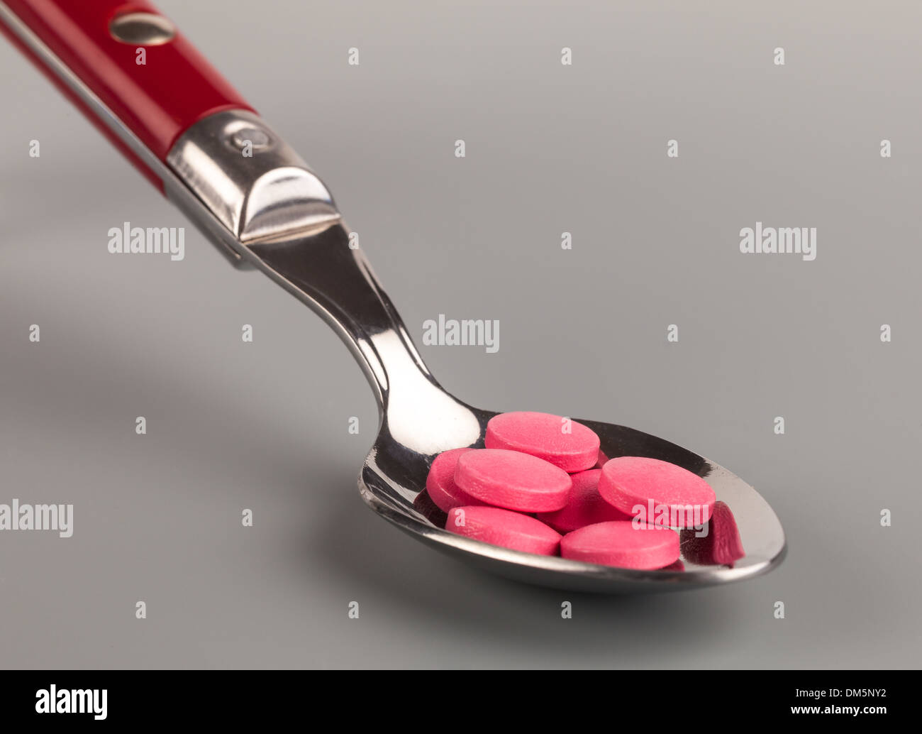 Spoon with medical drugs Stock Photo - Alamy