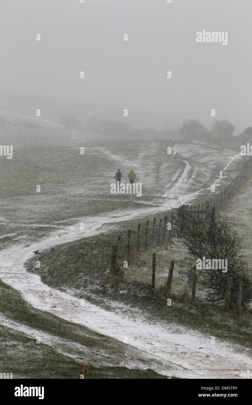 Two runners pictured running on Ditchling Beacon in heavy snow in ...