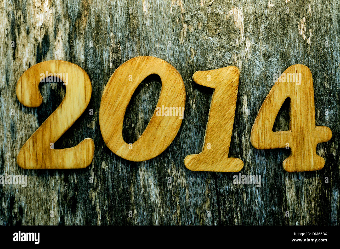 wooden numbers forming number 2014, as the new year, on an old wooden ...