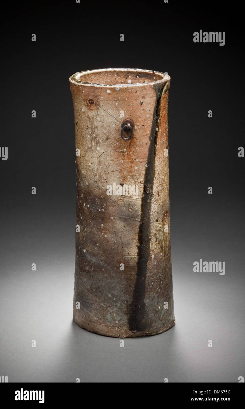 This Iga flower vessel, crafted from clay, represents the rich ...