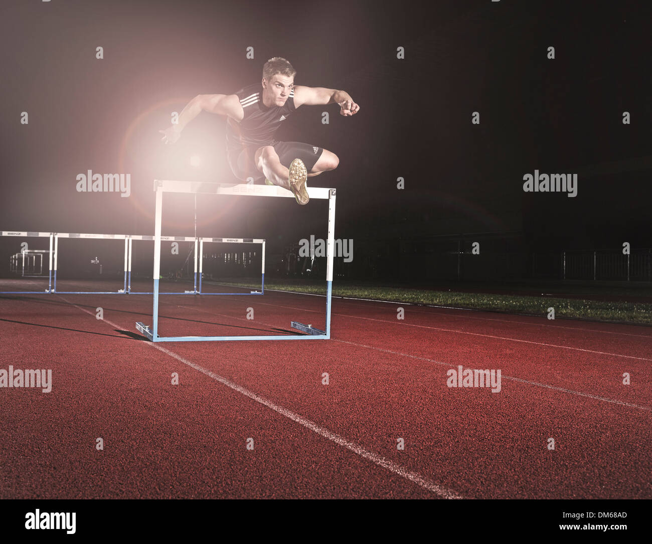 Hurdle racing athlete Stock Photo - Alamy