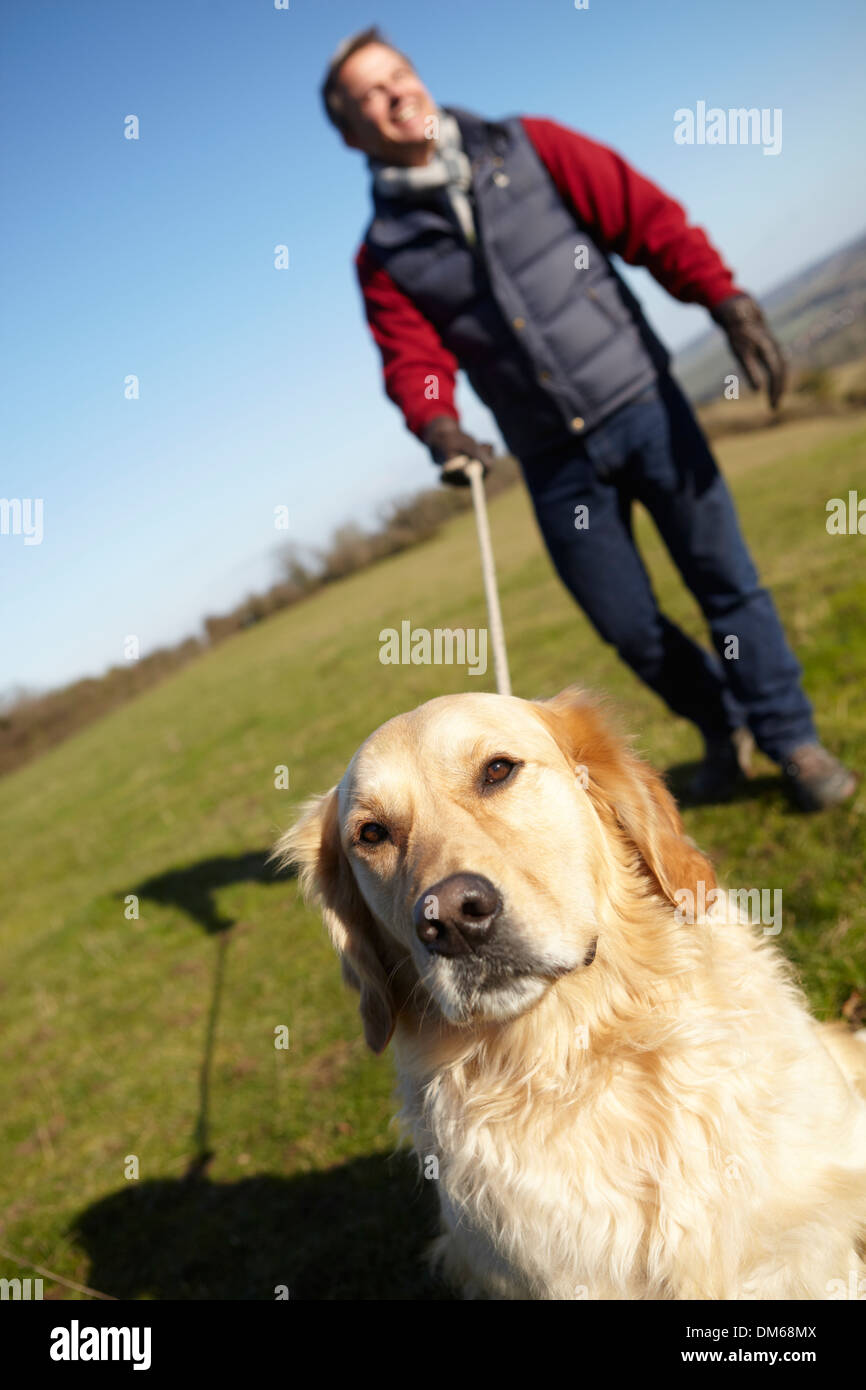 Man walking dog in woods hi-res stock photography and images - Alamy