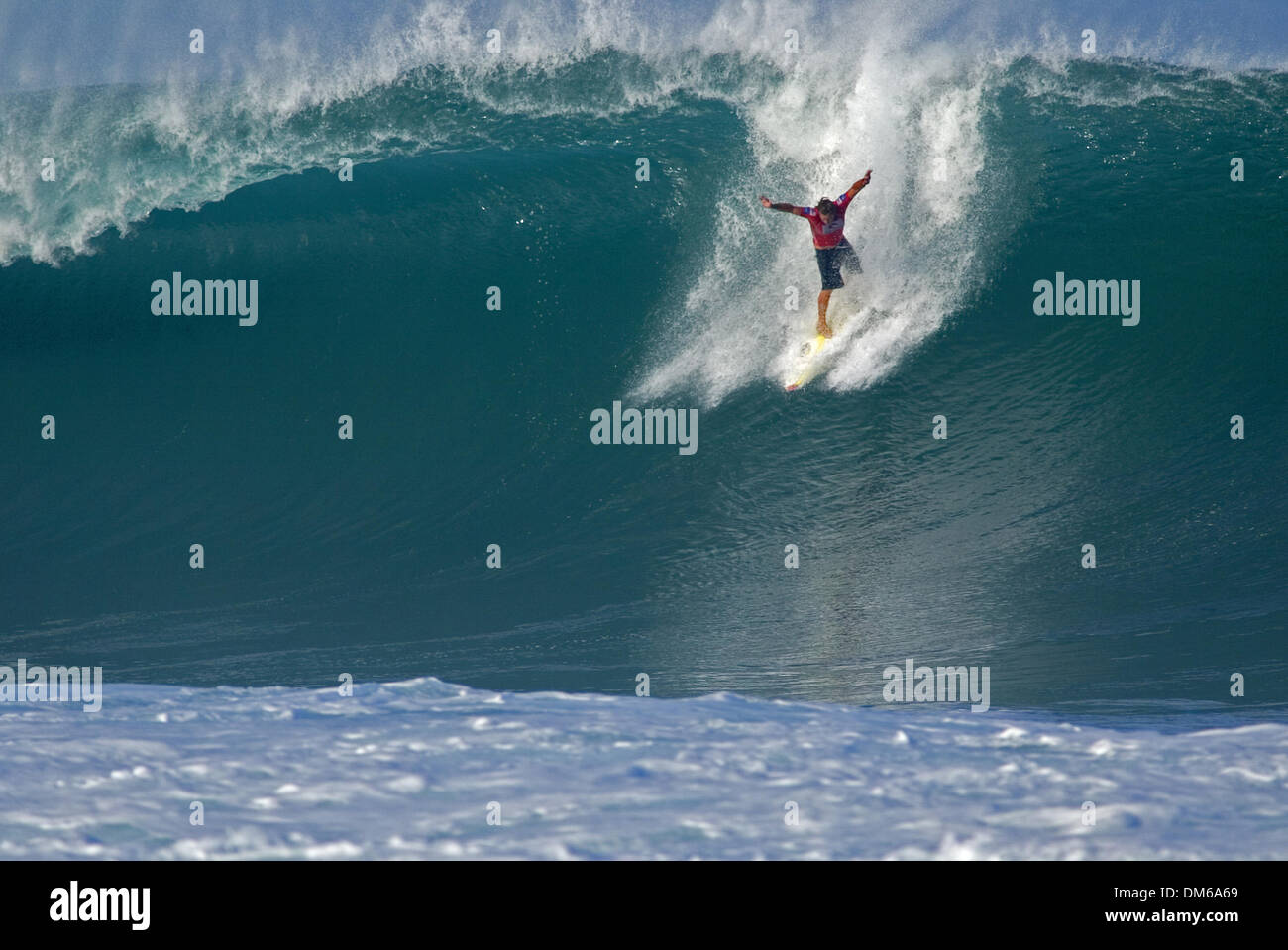 Dec 17, 2004; North Shore, HI, USA; Surfer LUKE EGAN drops in almost ...
