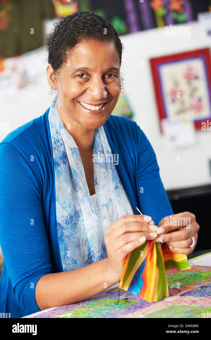 Portrait Of Woman Sewing Quilt Stock Photo - Alamy