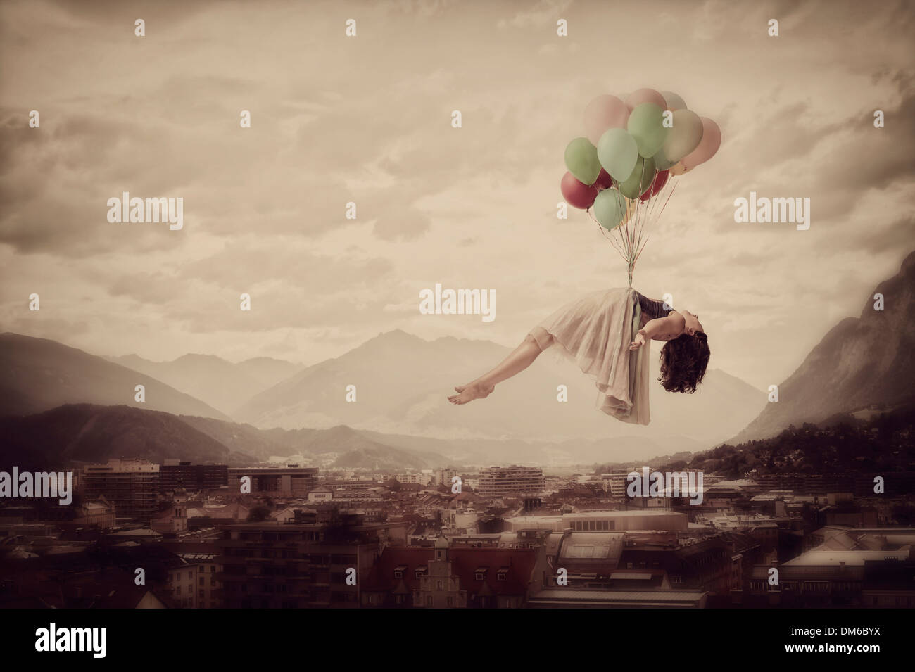 Girl hovering with balloons in the sky over a city Stock Photo - Alamy