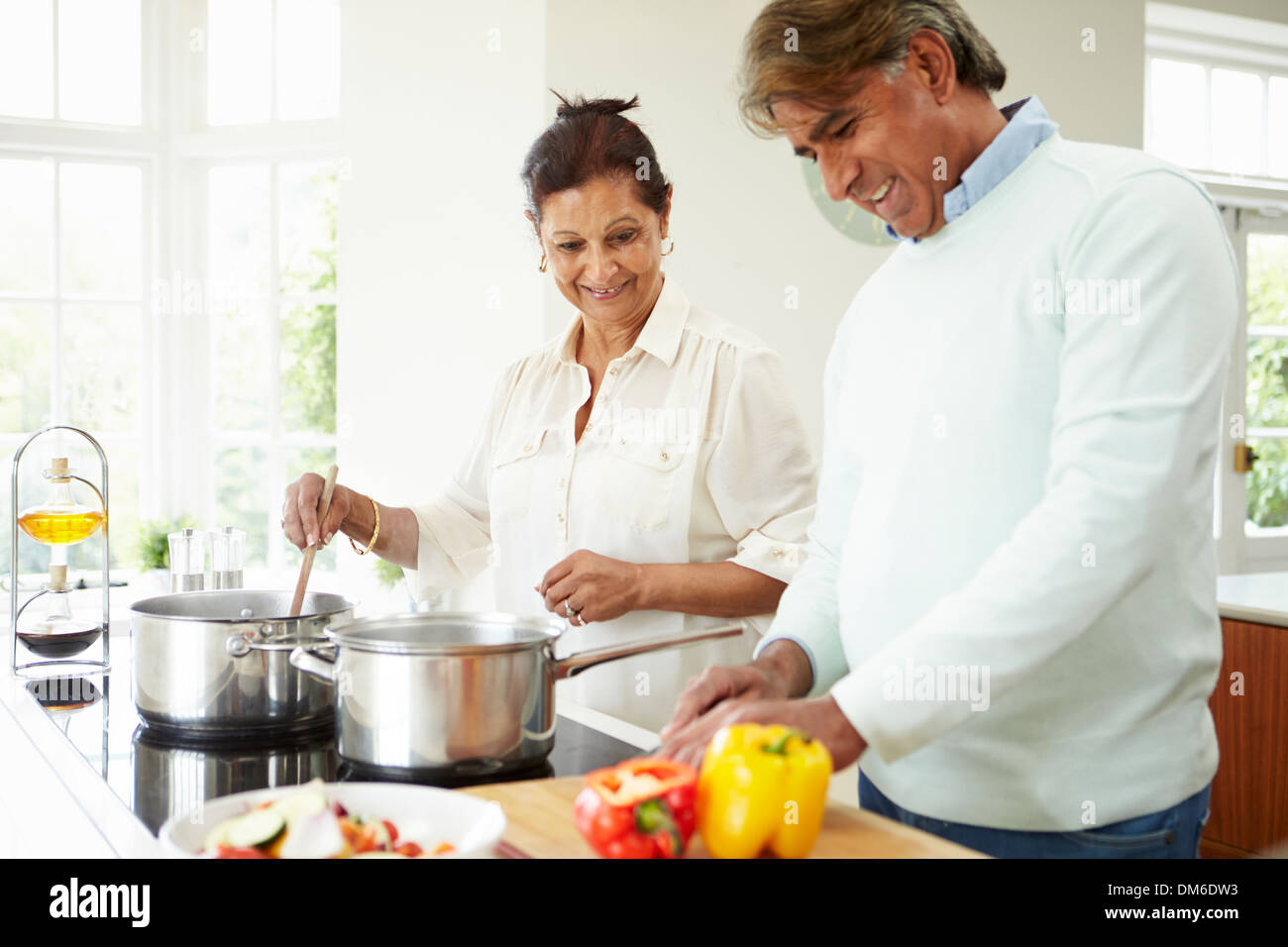 Senior Indian Couple Cooking Meal At Home Stock Photo - Alamy