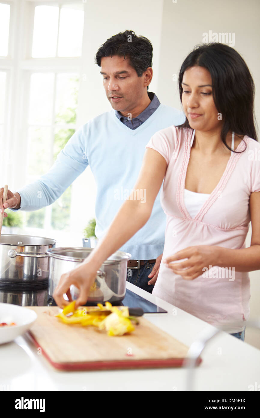 Indian Couple Cooking Meal At Home Stock Photo - Alamy