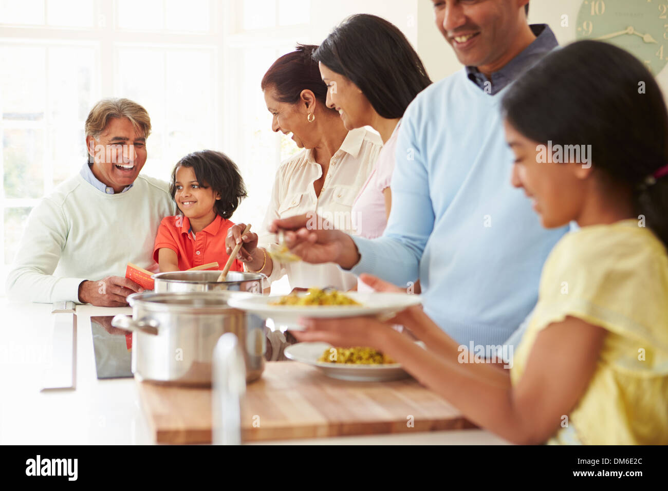 Multi Generation Indian Family Cooking Meal At Home Stock Photo - Alamy