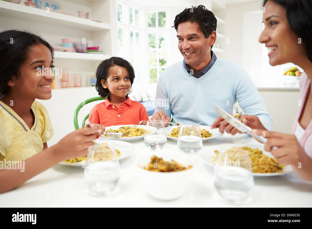 Indian Family Eating Meal At Home Stock Photo - Alamy