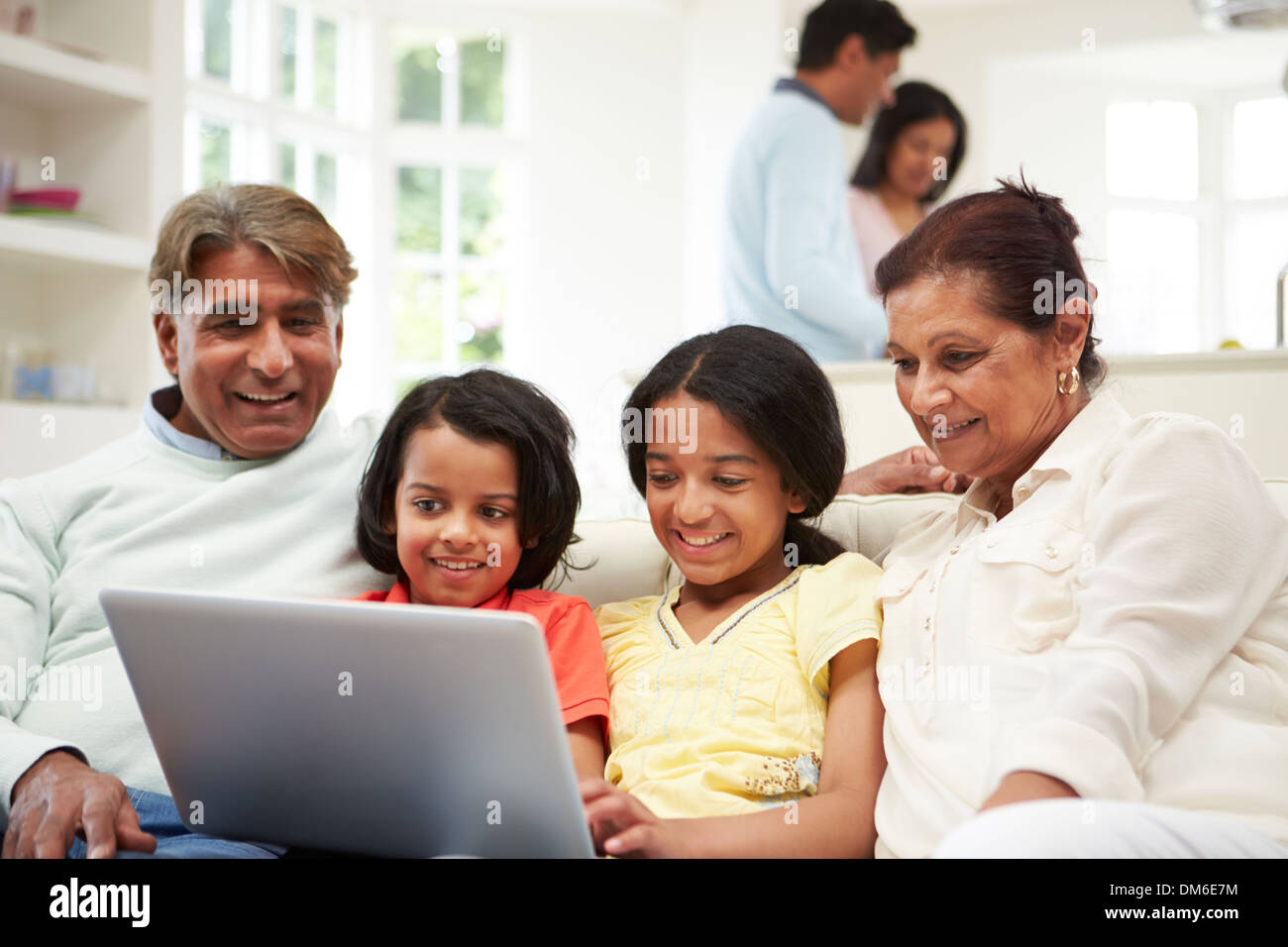 Multi-Generation Indian Family With Laptop Stock Photo - Alamy