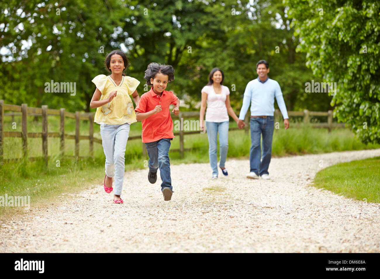 Indian Family Walking In Countryside Stock Photo - Alamy